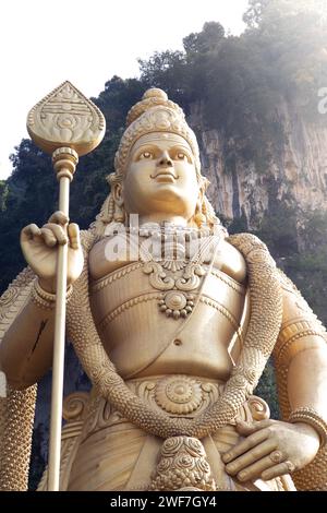 Golden statue of Maruga at Batu Caves during sunrise Stock Photo - Alamy