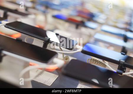 A lot of smartphone models on display at the exhibition stand of an ...