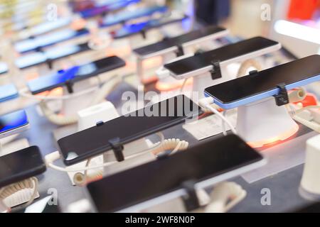 A lot of smartphone models on display at the exhibition stand of an ...