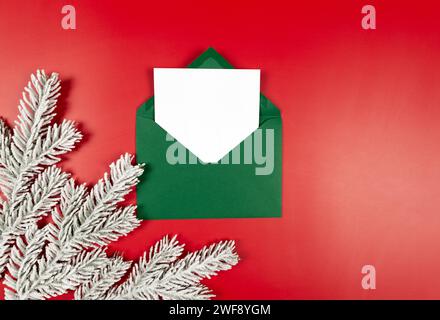Envelope with Christmas branches on color background Stock Photo - Alamy