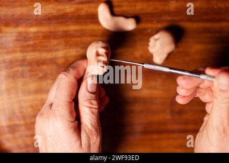 making a head sculpture with modeling clay Stock Photo - Alamy