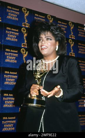 Oprah Winfrey holding her Emmy at the 1991 Daytime Emmy Award Ceremony ...
