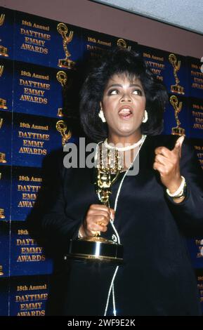 Oprah Winfrey holding her Emmy at the 1991 Daytime Emmy Award Ceremony ...