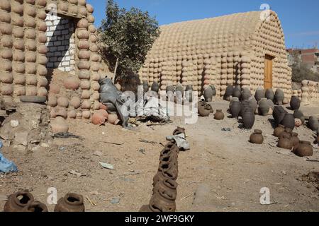 pottery, rubish, buildings in a village Stock Photo - Alamy