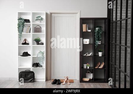 Interior of hall with door and shelf units Stock Photo - Alamy