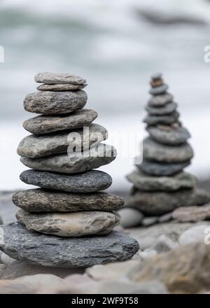 Close up of two towers of pebbles stacked up on a pebble beach Stock ...