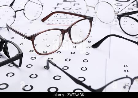 Vision test charts and glasses on table, closeup Stock Photo - Alamy