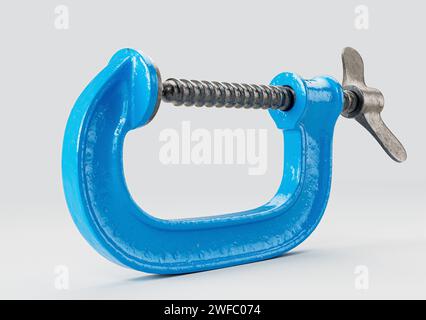 A blue vintage styled G-clamp tool on an isolated white studio ...