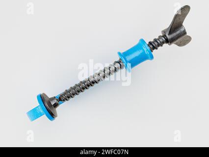 A blue vintage styled G-clamp tool on an isolated white studio ...