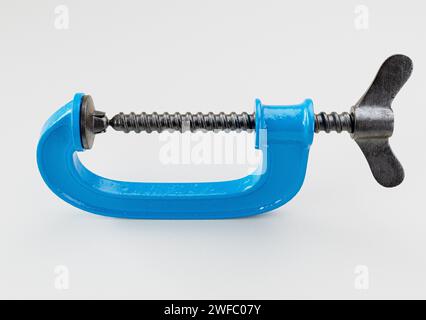 A blue vintage styled G-clamp tool on an isolated white studio ...