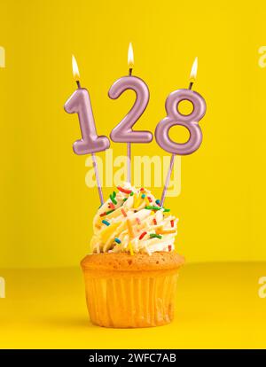 Candle number 128 in purple background - birthday card Stock Photo - Alamy