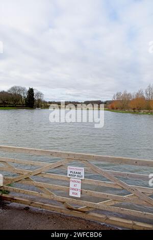 Parking at owner's risk. Flooding in rural areas Stock Photo - Alamy