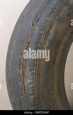 A close-up of a worn metal wheel hub with oil and rust elements on a ...
