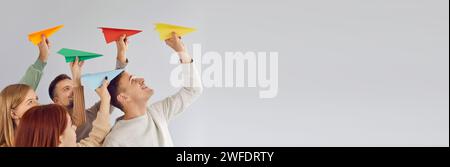 Paper planes on grey background Stock Photo - Alamy