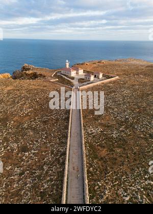 drone view of the Punta Nati lighthouse and coastal cliffs in ...