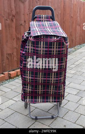 Wheeled Pull Along Upright Tartan Shopping Trolley Stock Photo - Alamy