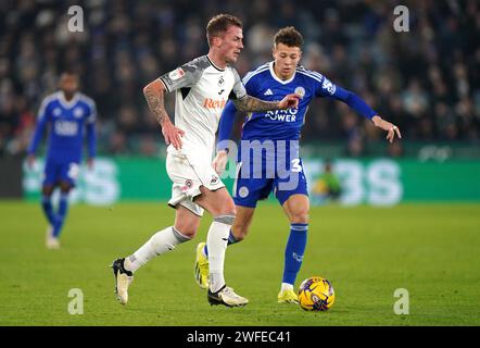 Swansea City's Josh Tymon (left) and Coventry City's Victor Torp battle ...