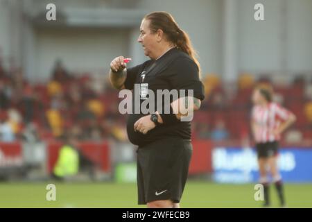 Referee Lucy Clark with pink whistle in mouth refereeing Brentford ...
