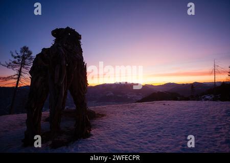 Wooden sculpture of a wolf made of tree branches. Vaia tempest wolf ...