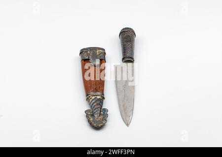 photograph of ancient dagger on white background with many details ...