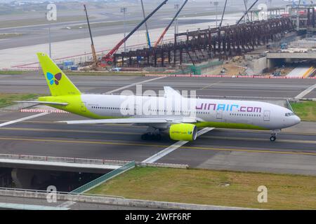 Jin Air Boeing 777 airplane taxiing. Aircraft B777 of JinAir airline ...