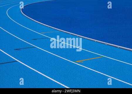 Blue Olympic track lanes with white stripes, an empty background ...