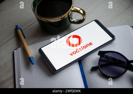 In this photo illustration, the Vodafone logo is seen displayed on a ...