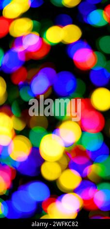 intentionally blurred background of many colorful lights of many colors ...