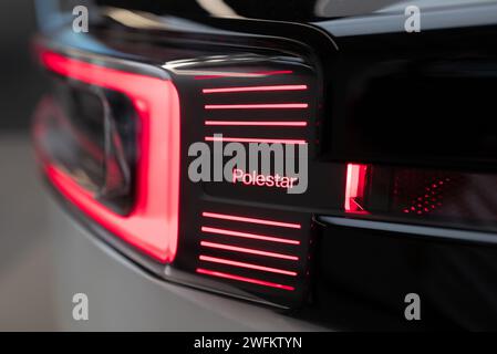 Close-up of illuminated Polestar vehicle emblem and taillight design at ...