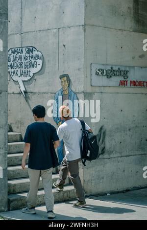 Two men walk up the stairs at the Congress Center where the Annnual ...