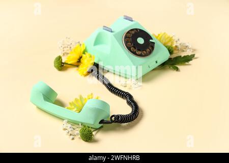Retro telephone with beautiful gypsophila and chrysanthemum flowers on ...