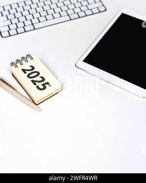 Business planning and forecasting in 2025. Notepad with 2025 on the ...