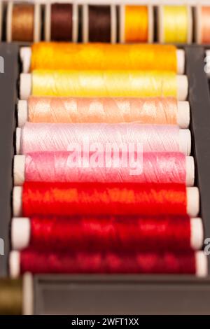 colorful sewing threads on spools Stock Photo - Alamy