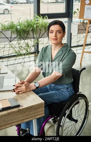 good looking confident disabled businesswoman in wheelchair talking by ...