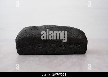 Charred food - badly burned homemade loaf of bread that has been left ...