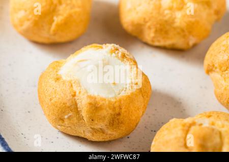 French Homemade Mini Cream Puff with whipped Filling Stock Photo - Alamy