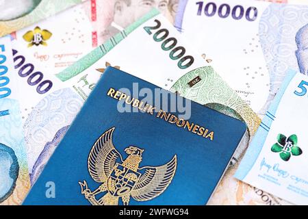 Indonesia passport and many indonesian rupiah currency money bills ...