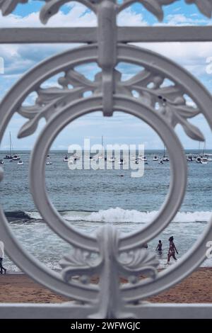 La Concha beach with boats and people Stock Photo - Alamy