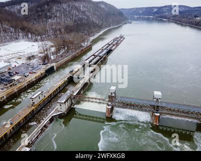 A towboat pushes 15 barges, most filled with coal, on the Ohio River ...