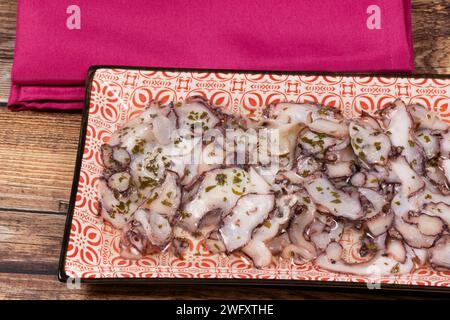 octopus carpaccio, close-up, in a dish Stock Photo - Alamy