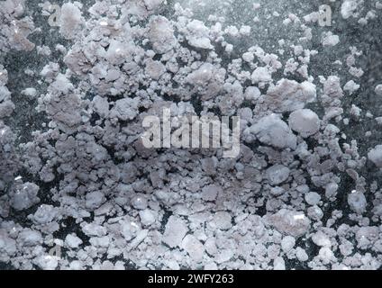 Silver chloride (AgCl) darkened from light, the product of the reaction ...