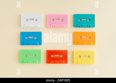 Old colorful cassettes on a colorful background. Music day, top view ...
