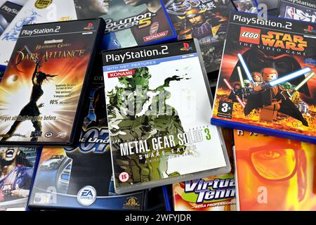 Playstation 2 PS2 video games cases arranged on bookshelf – Wales, UK ...