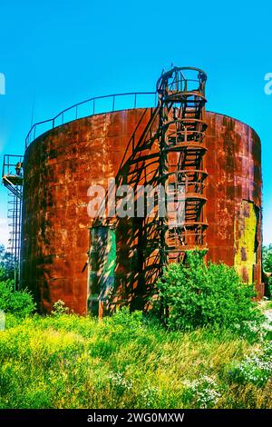 Old rusty oil tanks (fuel reservoir, oil barrel). Evidence of economic ...