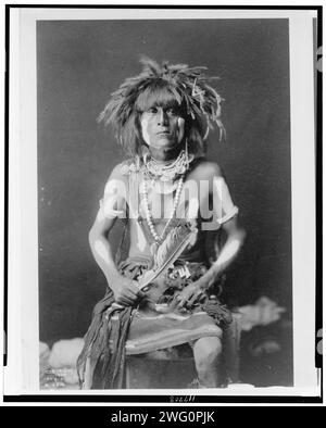 Honovi-Walpi snake priest, with Totkya Day painting, c1910. Hopi snake ...