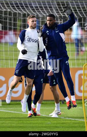 AMSTERDAM - Jordan Henderson of Ajax and Jorrel Hato of Ajax during a ...