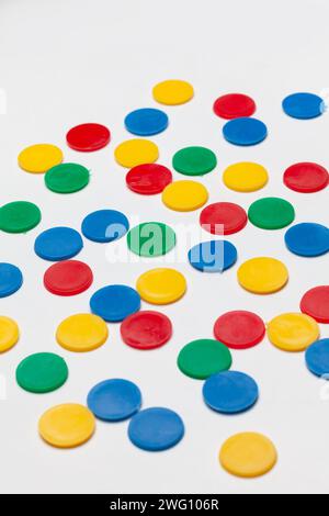 colorful round plastic tokens isolated on white background Stock Photo ...