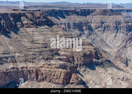 aerial landscape with escarpment worn slopes and meandering dry ...