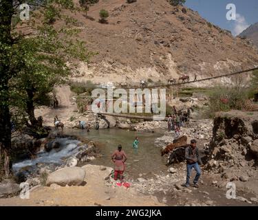 A lively river scene in Sarkegad, a rural Nepali mountain village in ...
