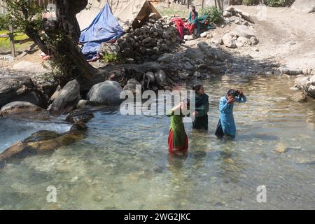 A lively river scene in Sarkegad, a rural Nepali mountain village in ...